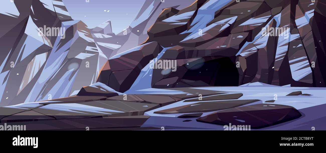 Entrance to cave in mountain with ice and snow on rocks around. Grotto ...