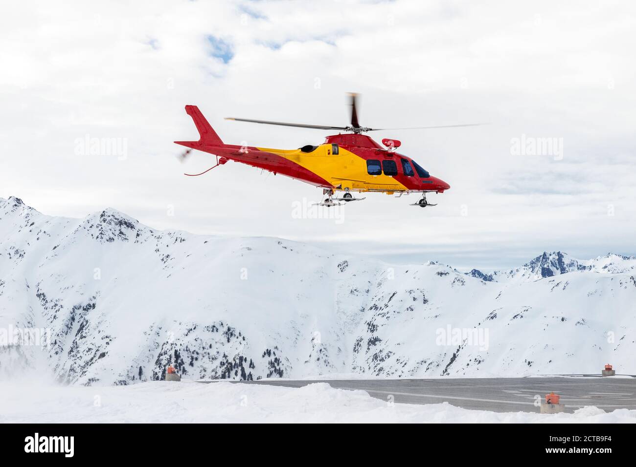 Mountain ski life rescue medic helicopter taking-off from station ...
