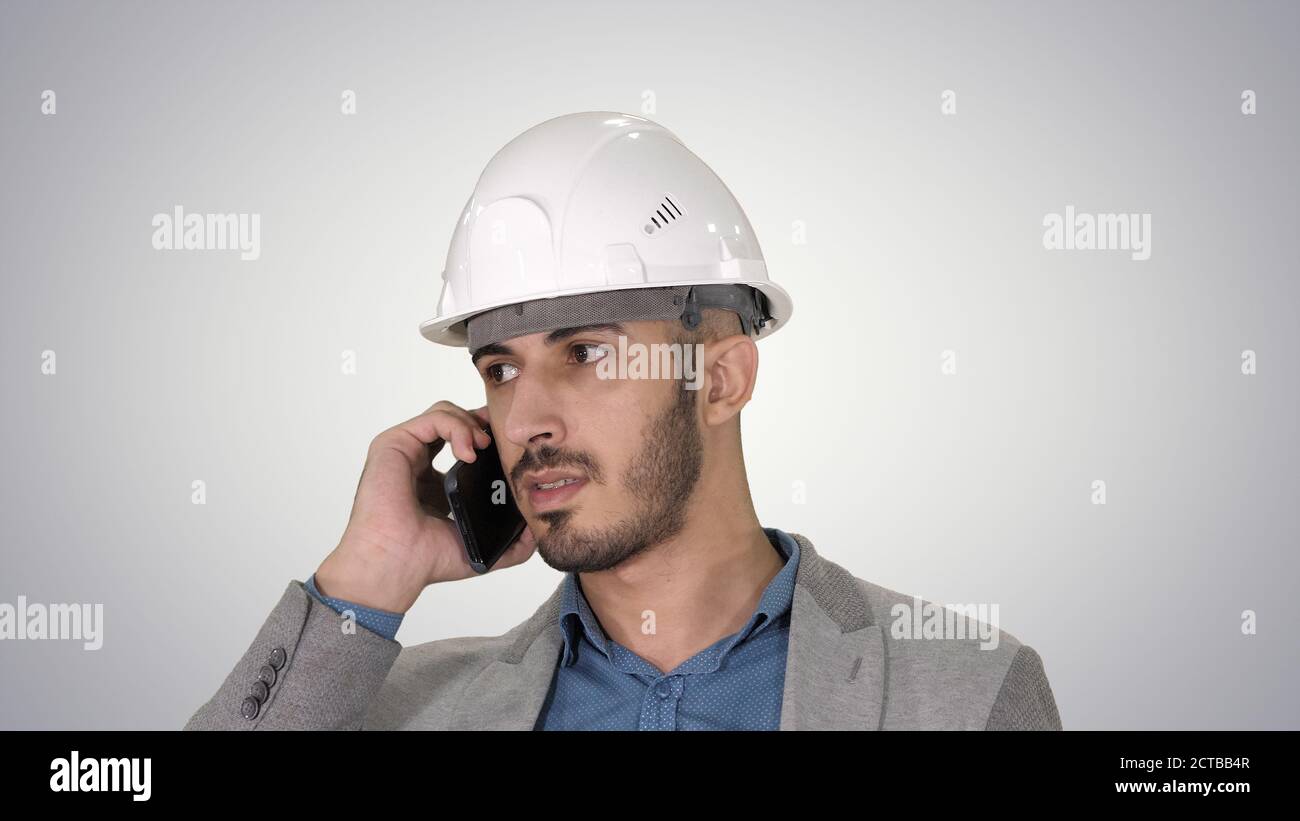Engineer talking a mobile phone inspecting construction work of Stock ...