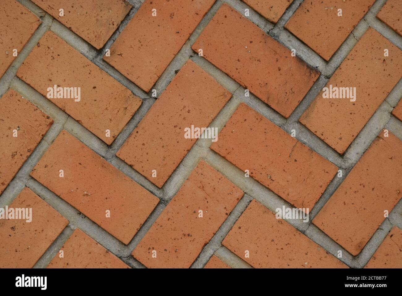 Brick wall, forming a coating of small architectural figures, abstract ...