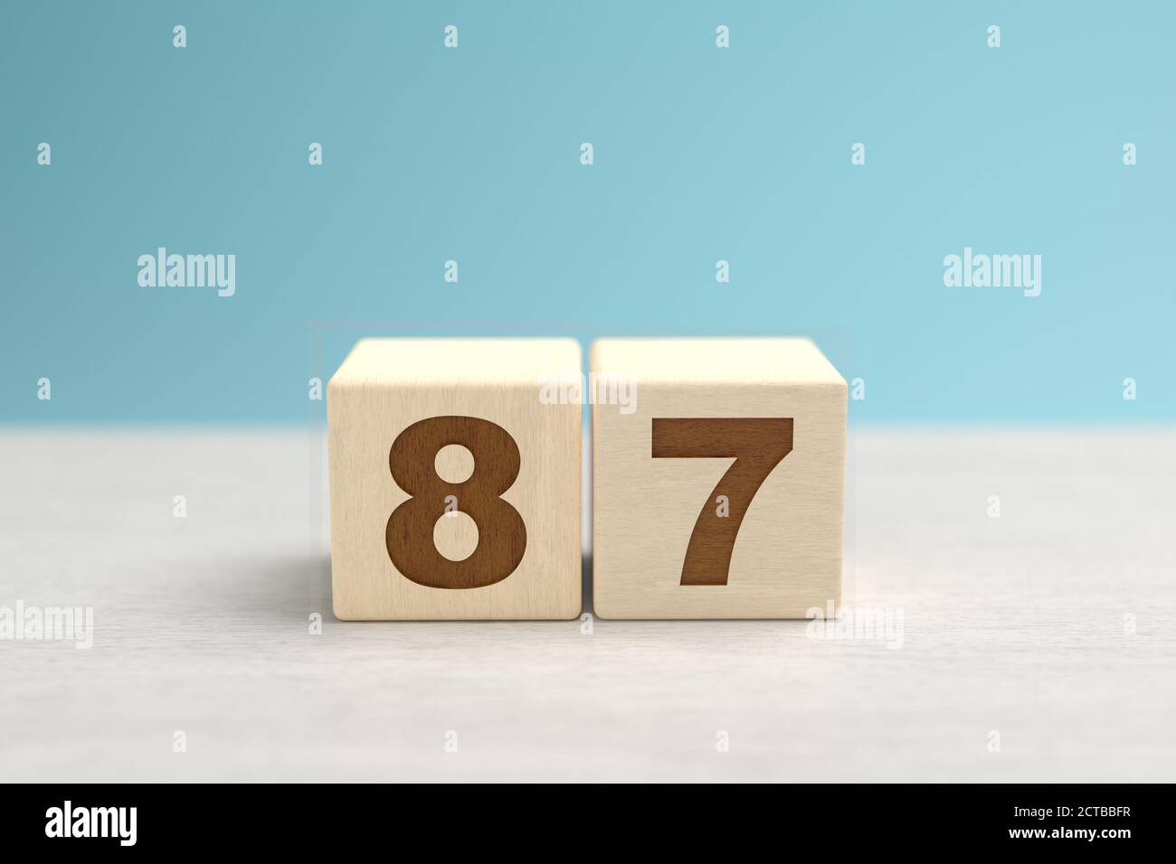 Wooden toy blocks forming the number 87 Stock Photo - Alamy