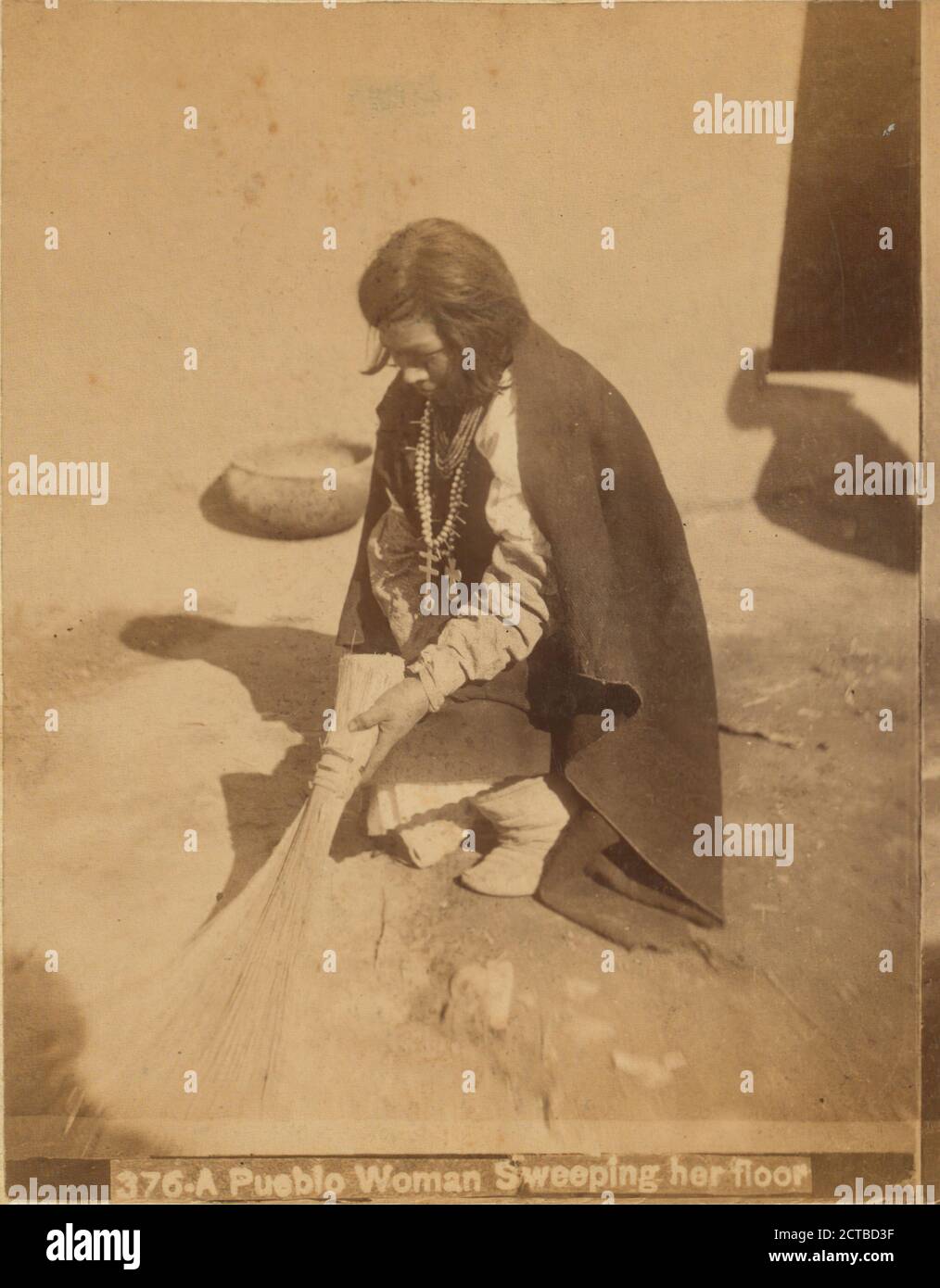 Pueblo woman sweeping hi-res stock photography and images - Alamy