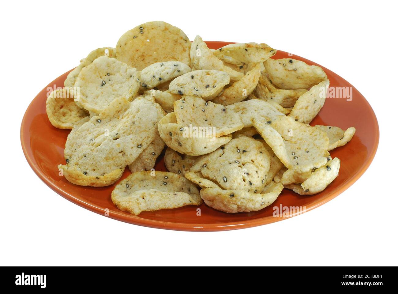 Fish crackers in plate isolated on white background Stock Photo - Alamy