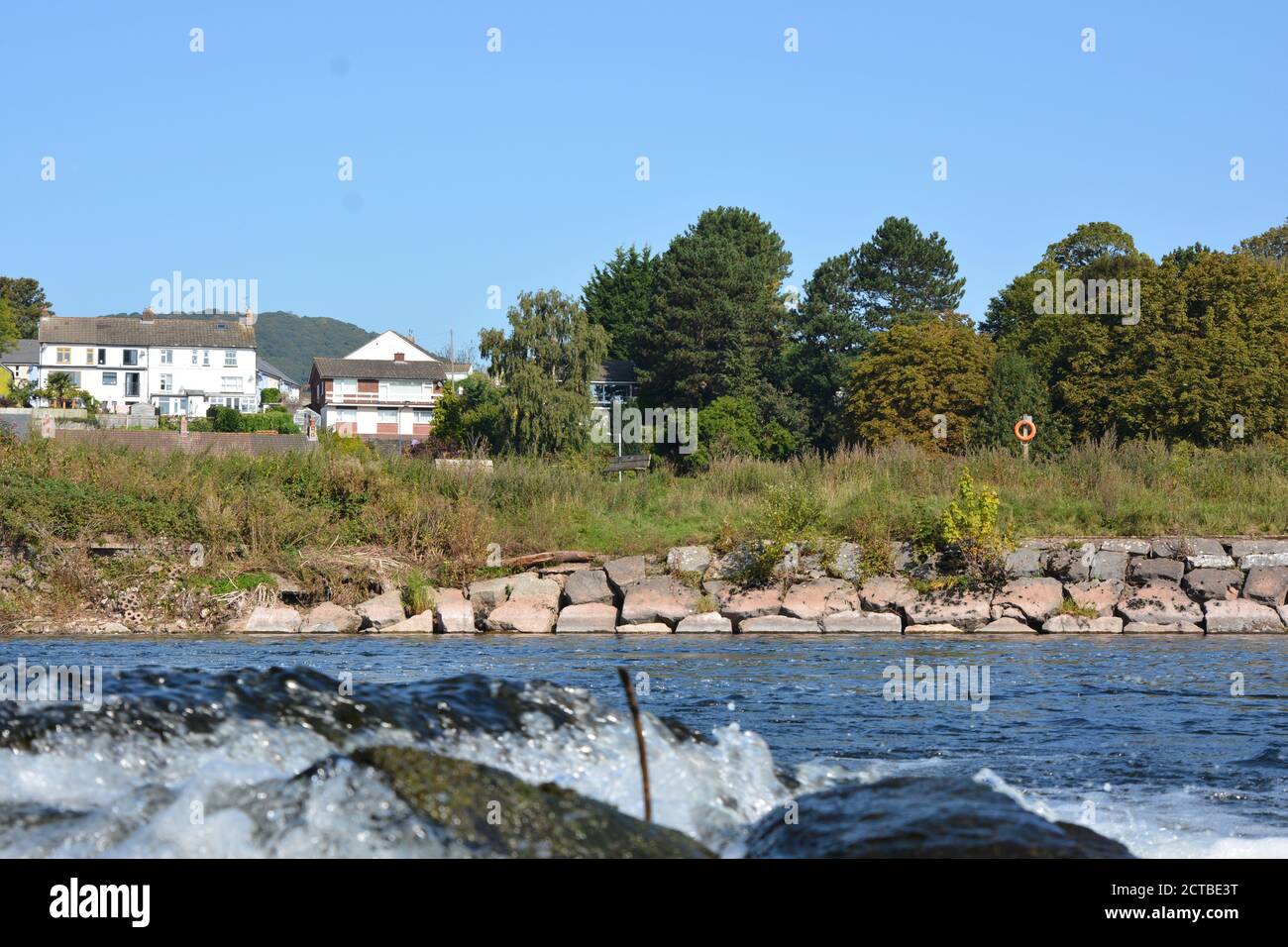 The Usk River in Abergavenny, ancient bridge spanning the river which ...