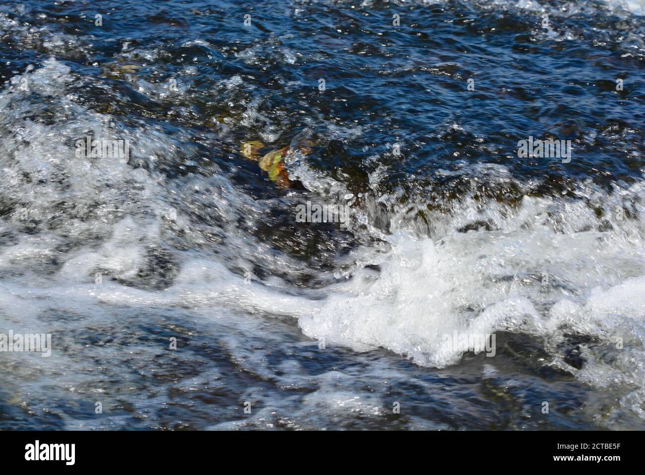 The Usk River in Abergavenny, ancient bridge spanning the river which ...