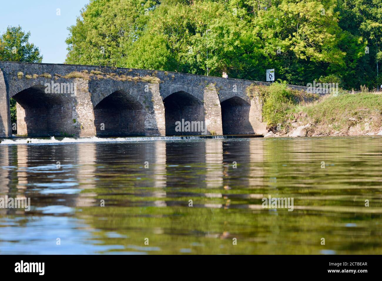The Usk River in Abergavenny, ancient bridge spanning the river which ...
