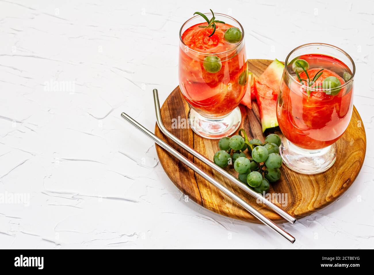 Fresh non-alcoholic fruit cocktail. Juicy watermelon, green grape ...