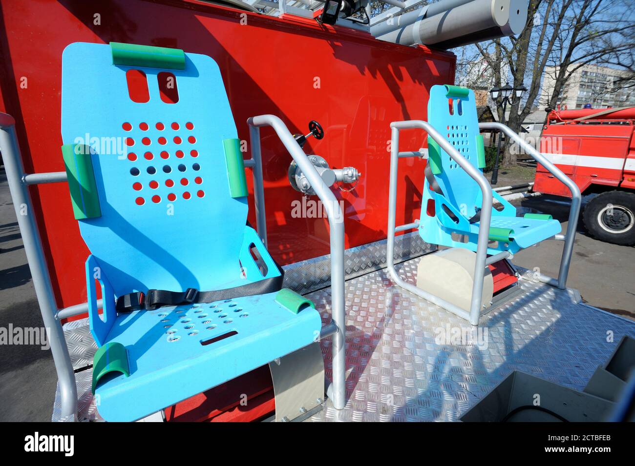 Seats for firefighters set on the firetruck Stock Photo - Alamy