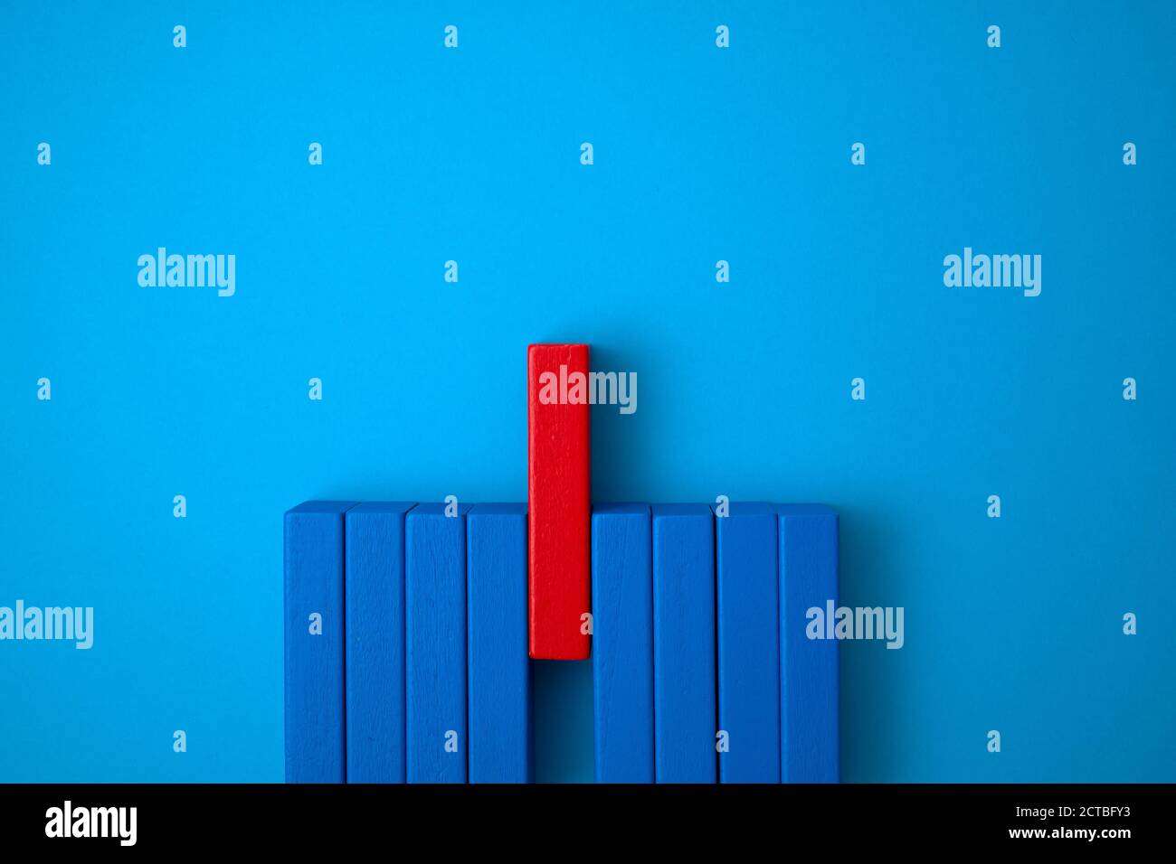 red block blocking blue blocks Stock Photo - Alamy