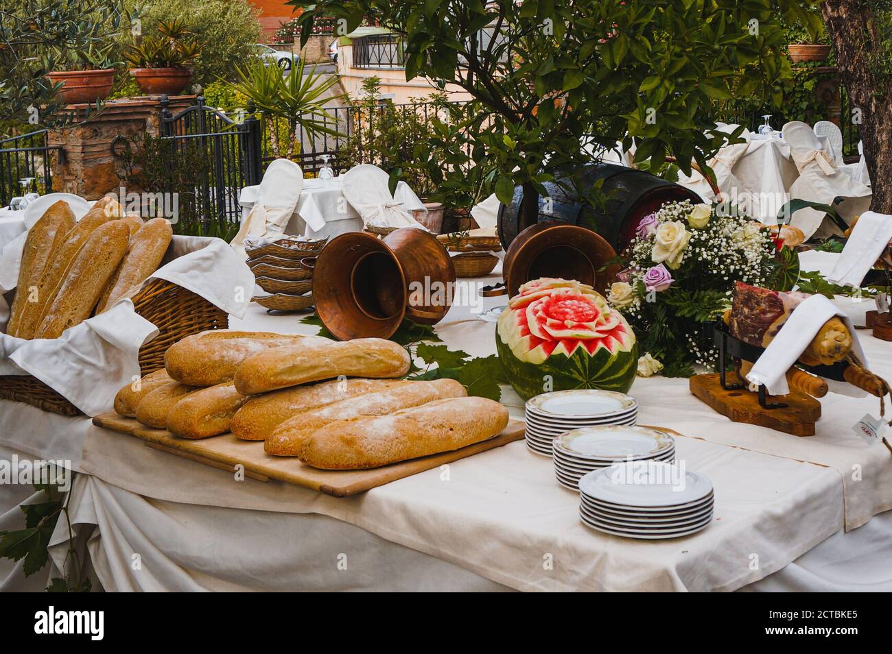 Beautiful Italian feast table with loaves of freshly baked bread ...