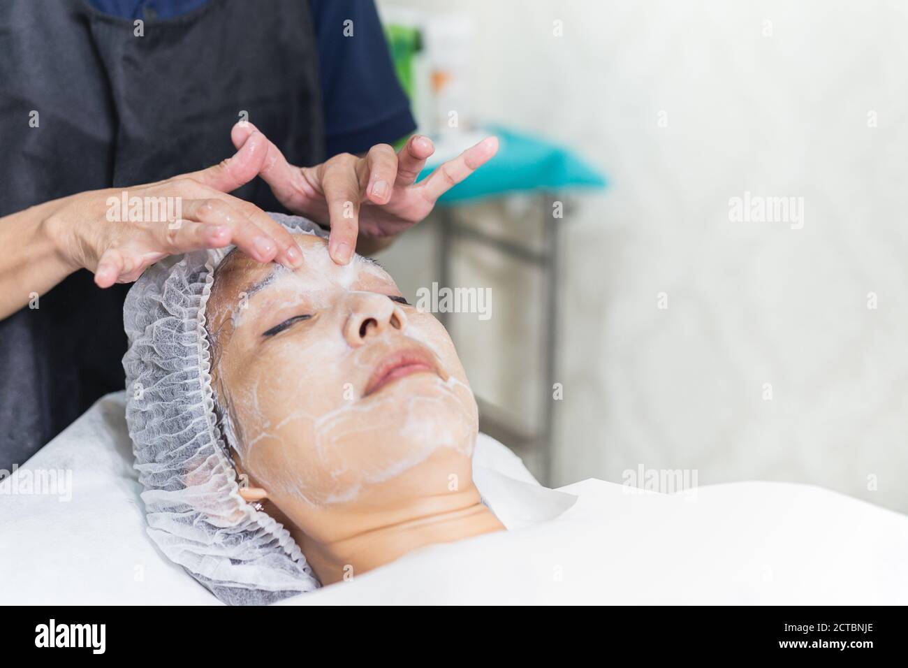 Woman getting spa massage treatment at beauty spa salon Stock Photo - Alamy