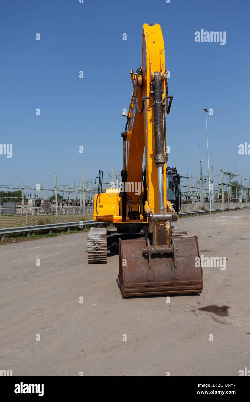 Vertical shot of an excavator in a construction site Stock Photo - Alamy