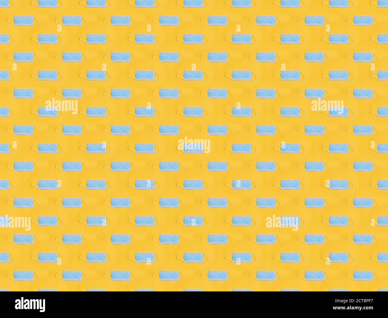 Surgical mask pattern on yellow background Stock Photo - Alamy