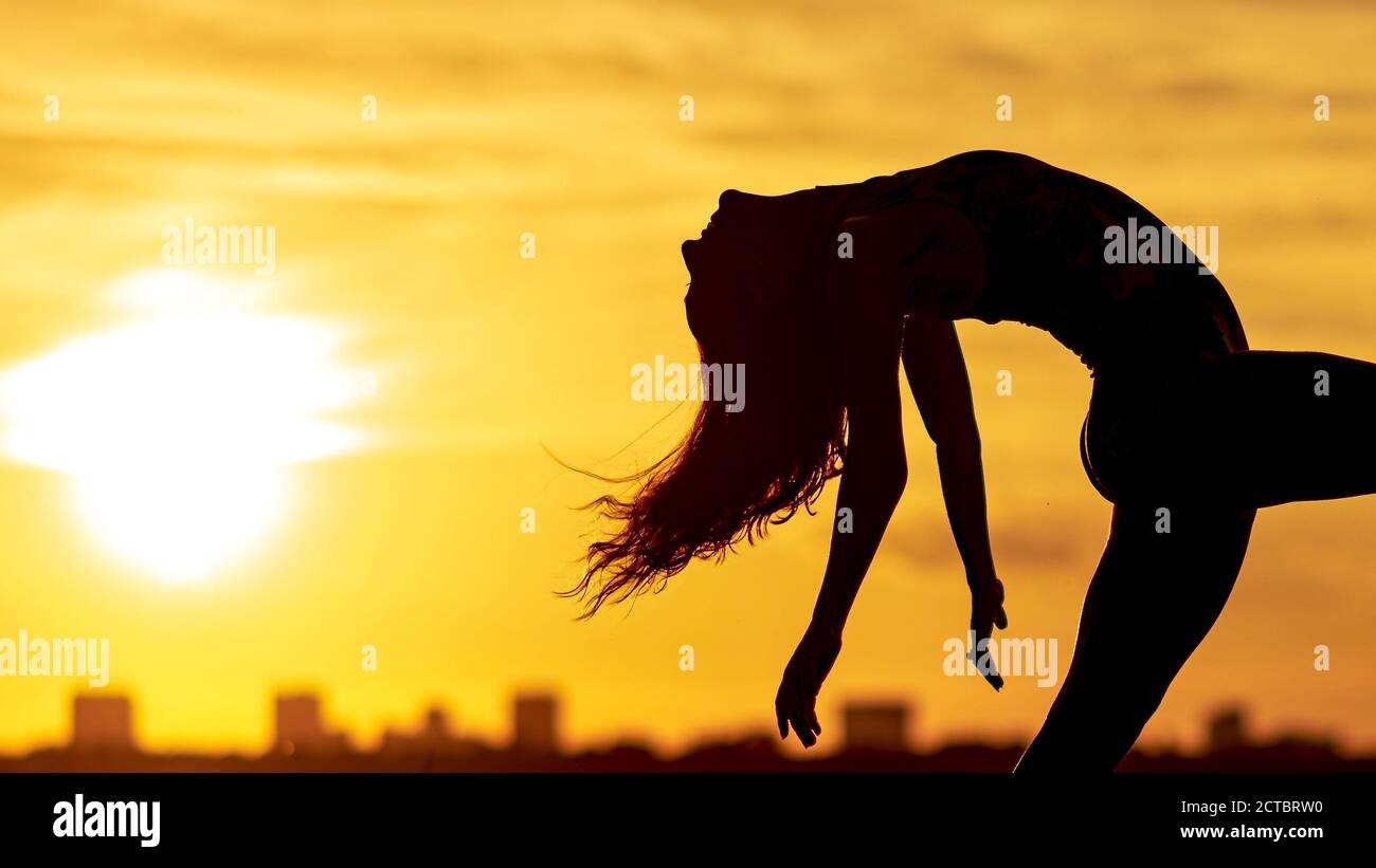 silhouette of ballerina at sunsel Stock Photo - Alamy