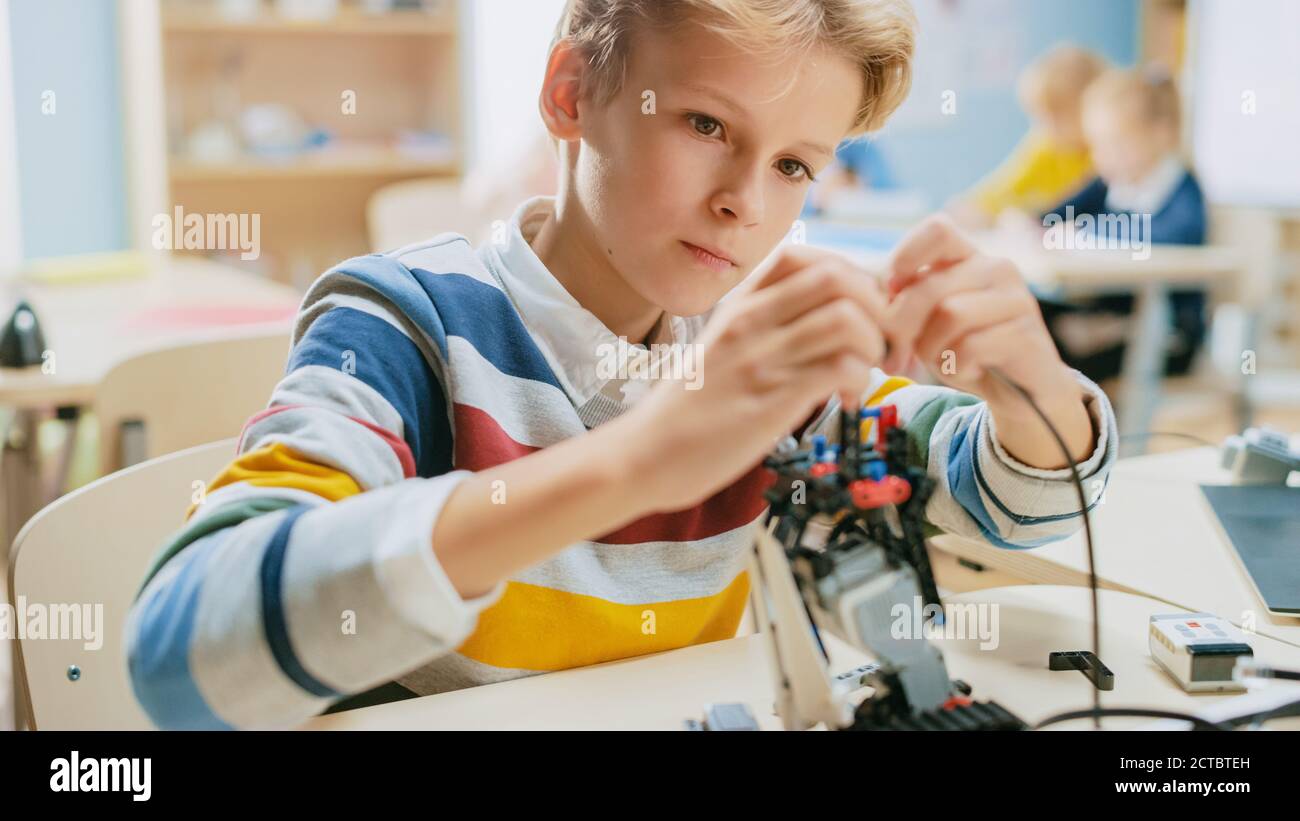 Smart Schoolboy Builds Constructs Small Robot and Uses Laptop to ...