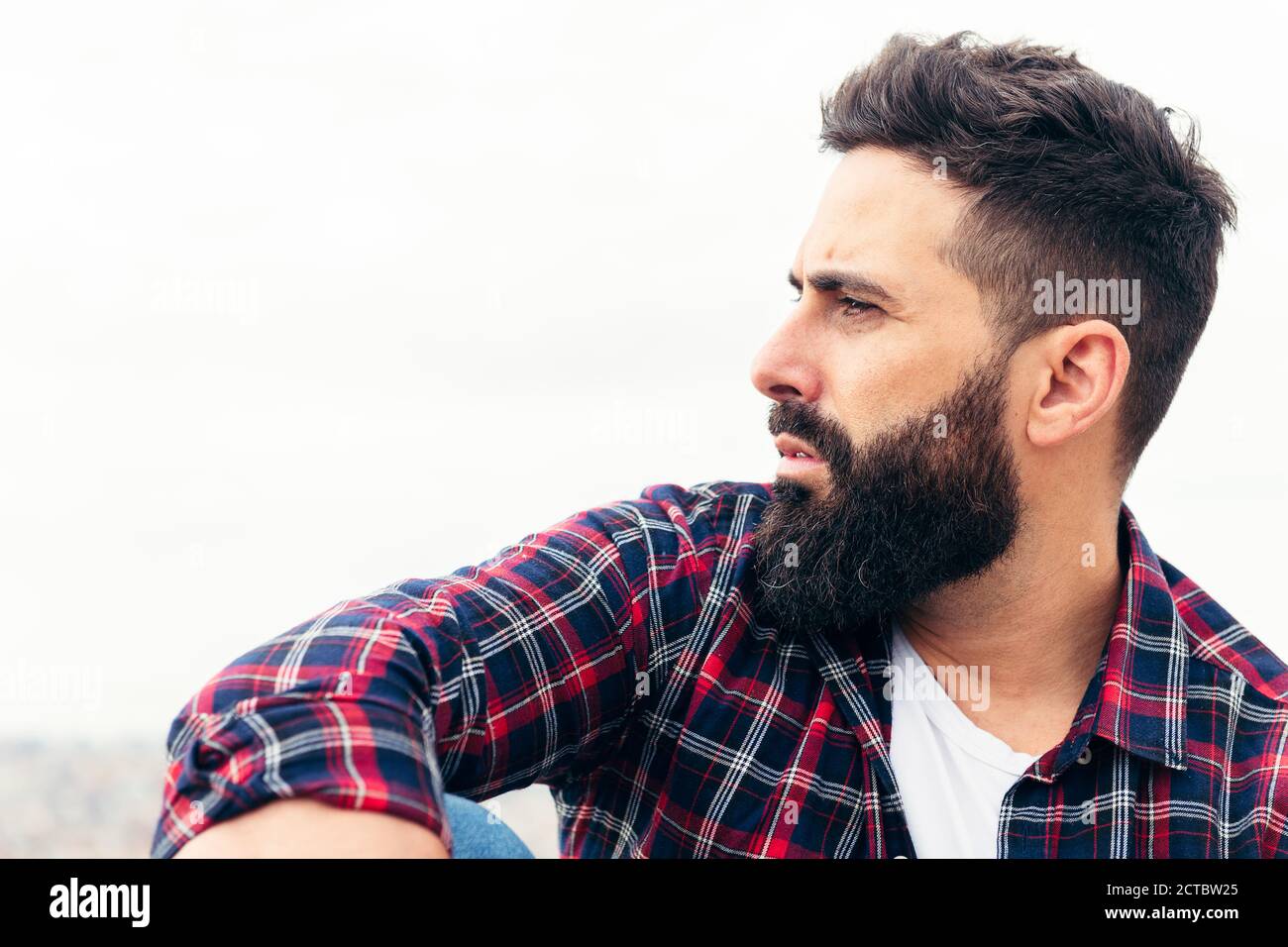 profile portrait of a handsome bearded man, concept of beauty and ...