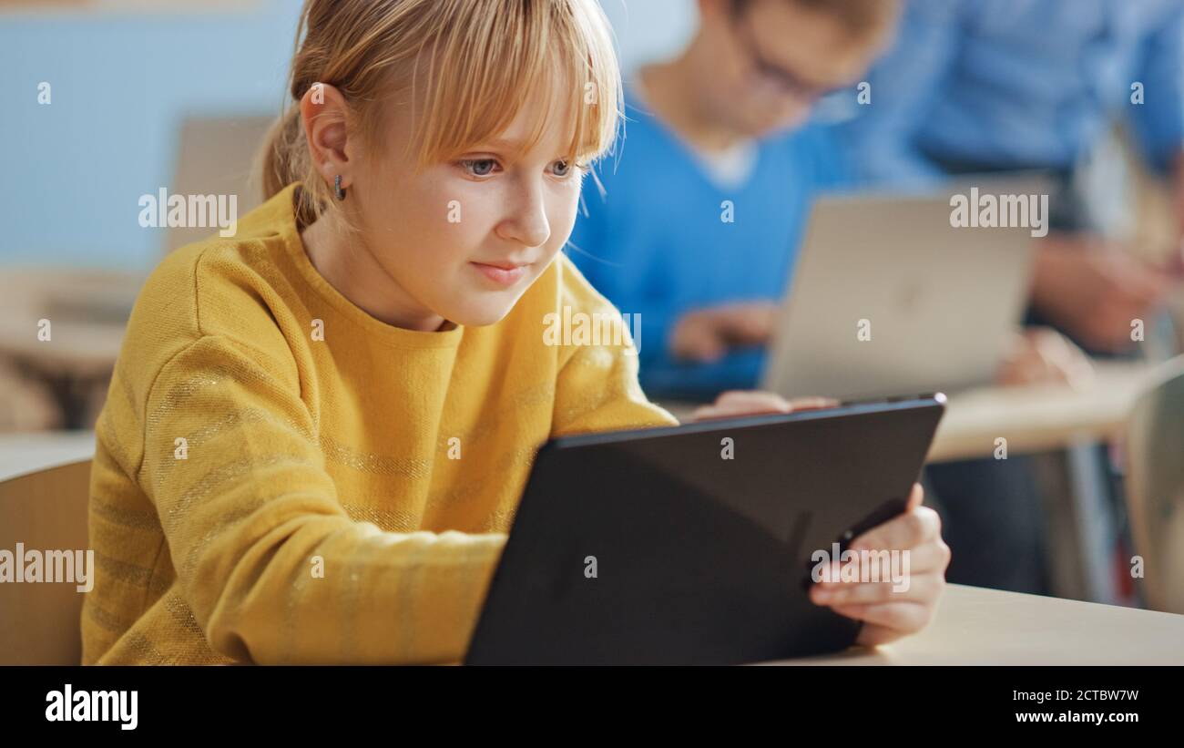 Elementary School Computer Science Class Cute Girl Uses Digital Tablet Computer Her Classmates