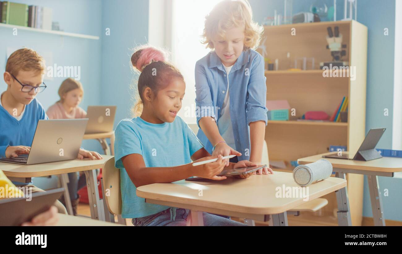 Elementary School Computer Science Class: Smart Girl Uses Digital ...
