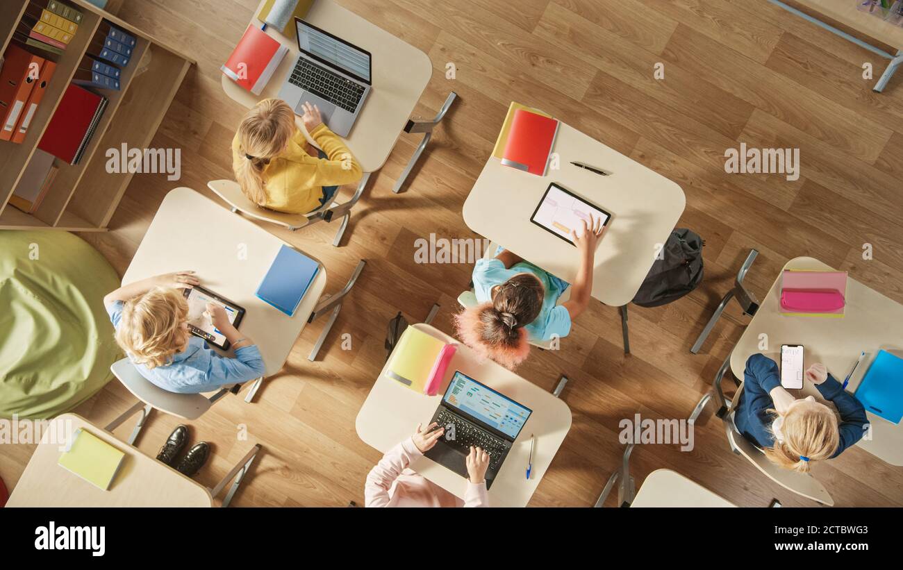 Top View Shot in Elementary School Computer Science Classroom: Children ...