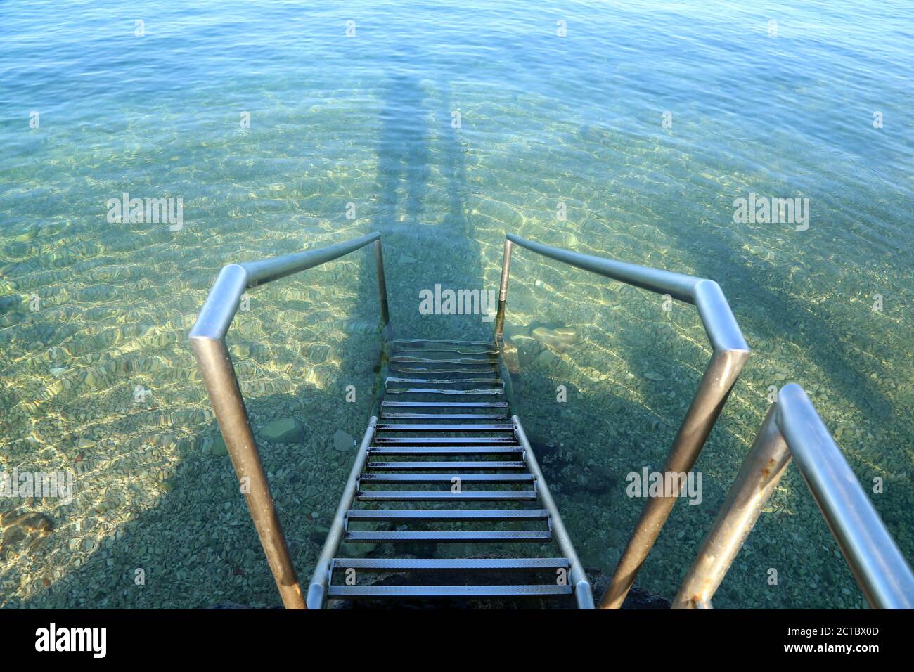 Metal ladder for launching into the water Stock Photo - Alamy