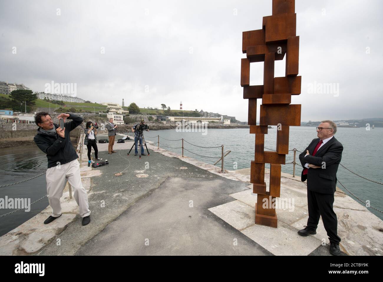 Sir Antony Gormley (left) takes photograph of Councillor Tudor Evans ...