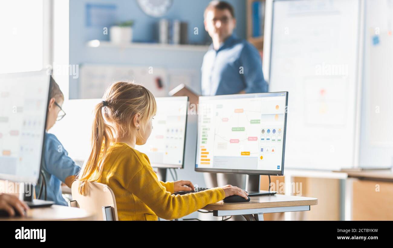 Elementary School Computer Science Classroom: Cute Little Girl Uses ... Elementary School Computer Science Classroom: Cute Little Girl Uses ...
