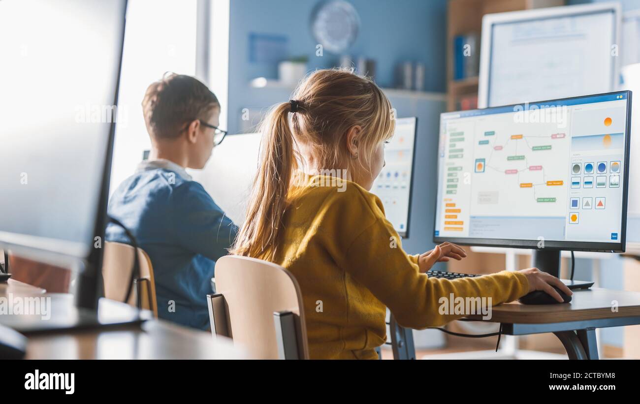 Elementary School Computer Science Classroom: Cute Little Girl Uses ... Elementary School Computer Science Classroom: Cute Little Girl Uses ...