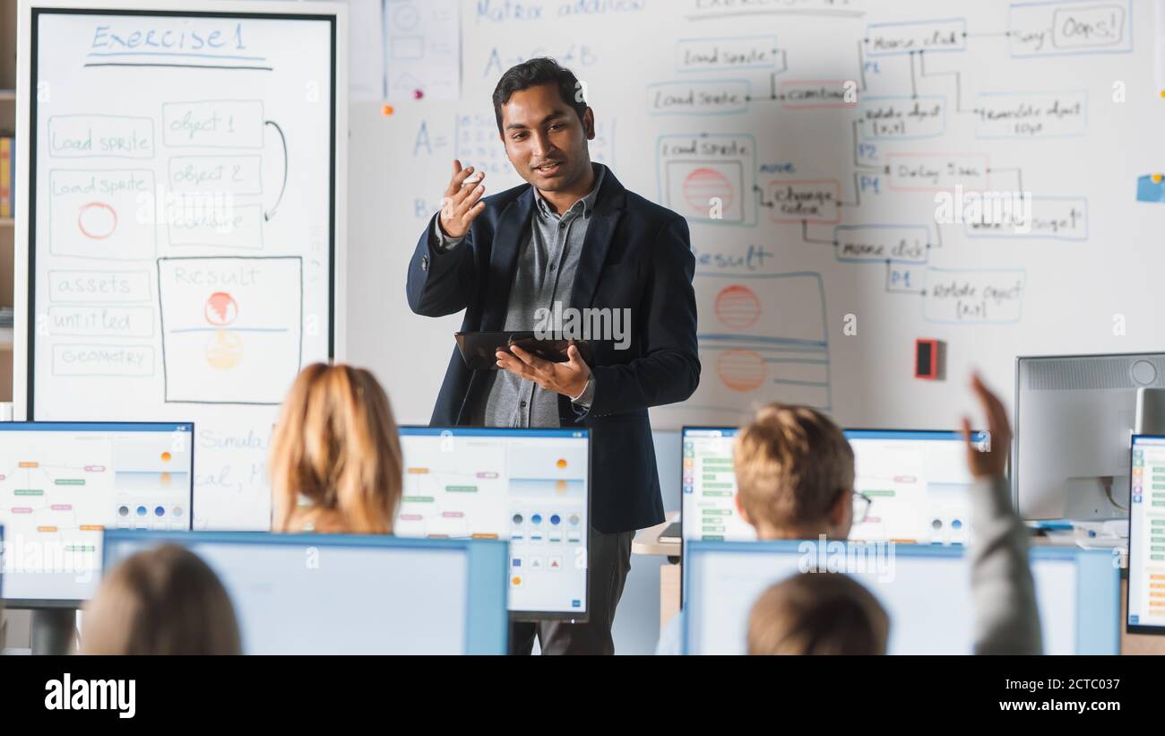Elementary School Computer Science Class: Teacher Uses Digital Tablet ...
