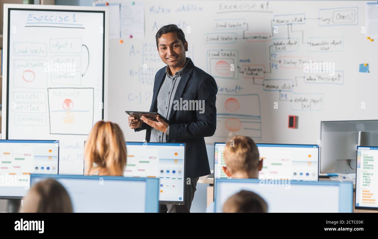 Elementary School Computer Science Class: Teacher Uses Digital Tablet ...