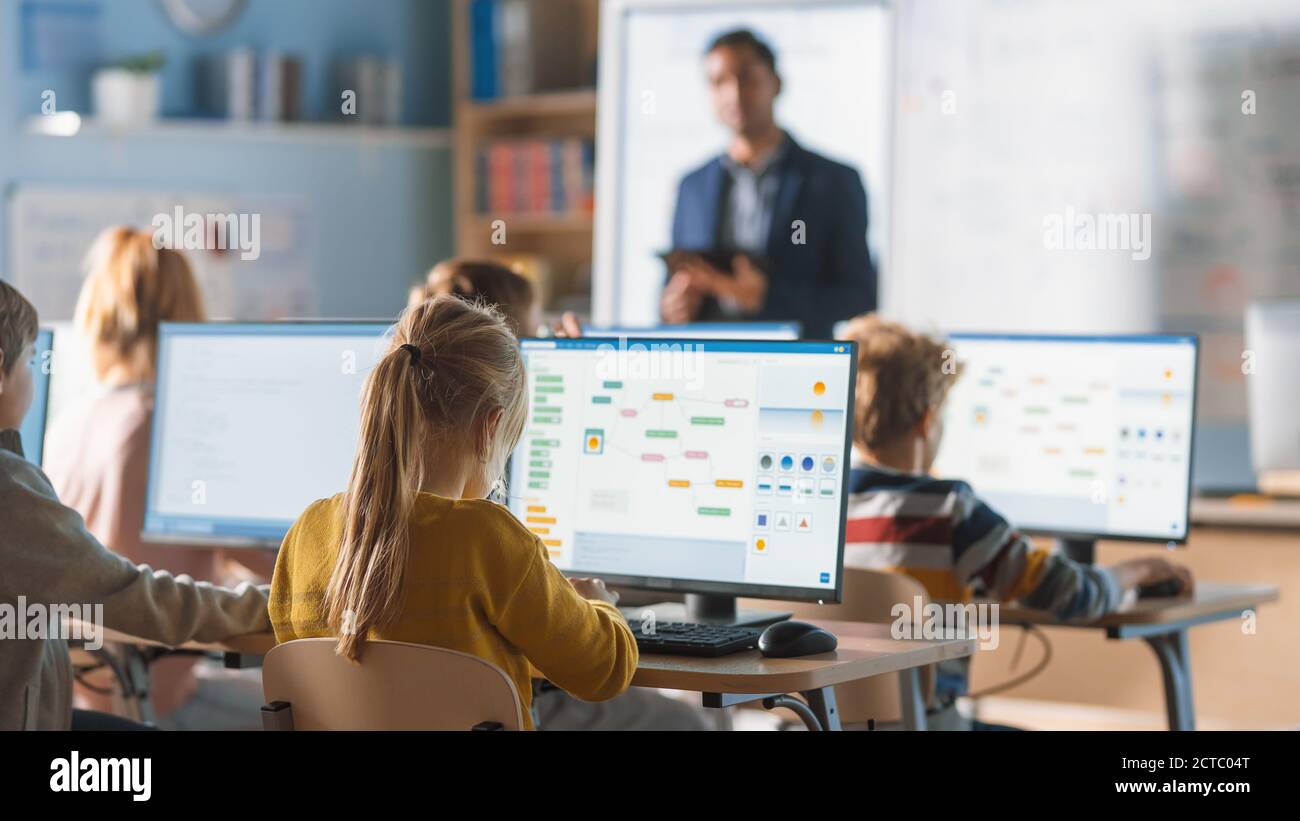 Elementary School Computer Science Class: Teacher Uses Digital Tablet ...