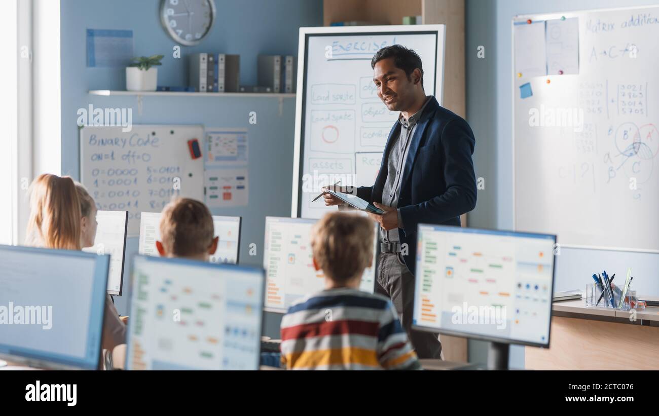 Elementary School Computer Science Class: Teacher Uses Digital Tablet ...