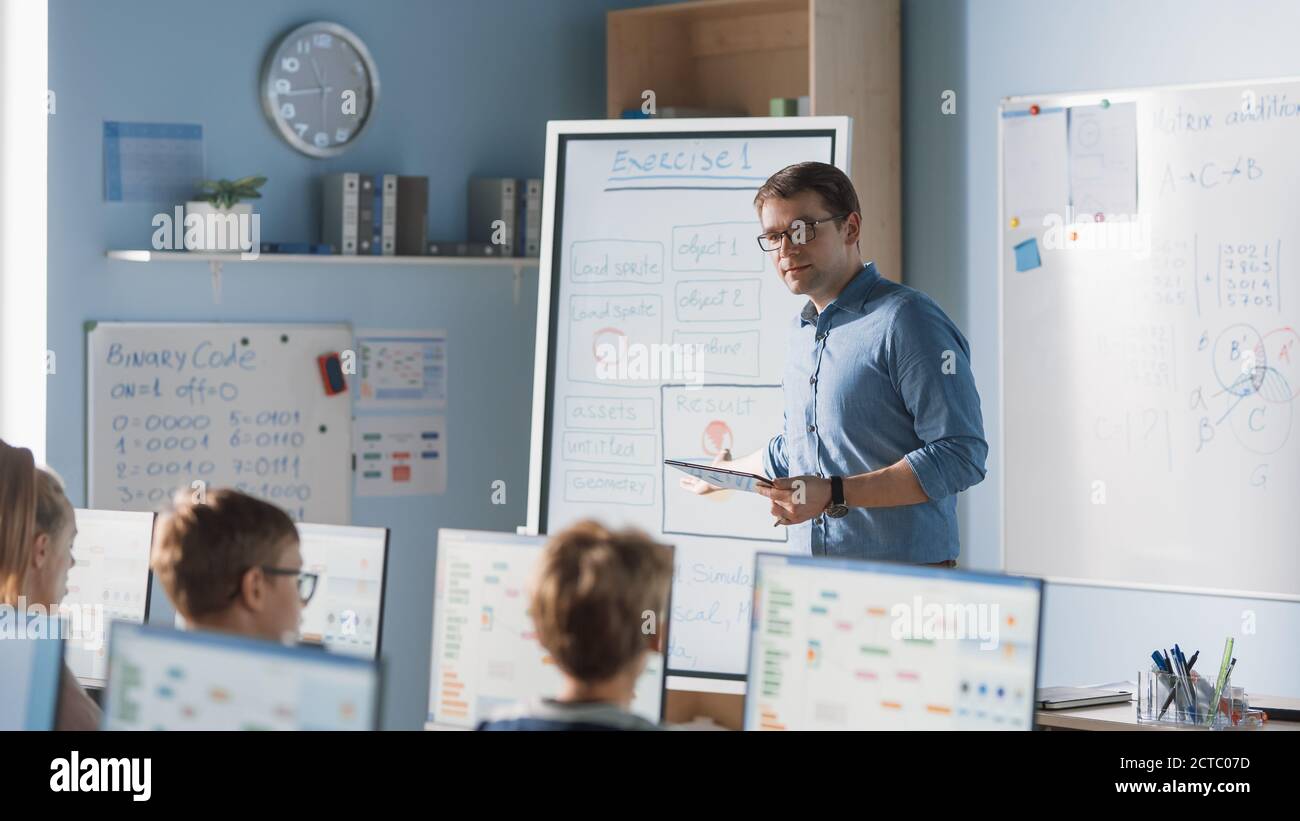 Elementary School Computer Science Class: Teacher Uses Digital Tablet ...