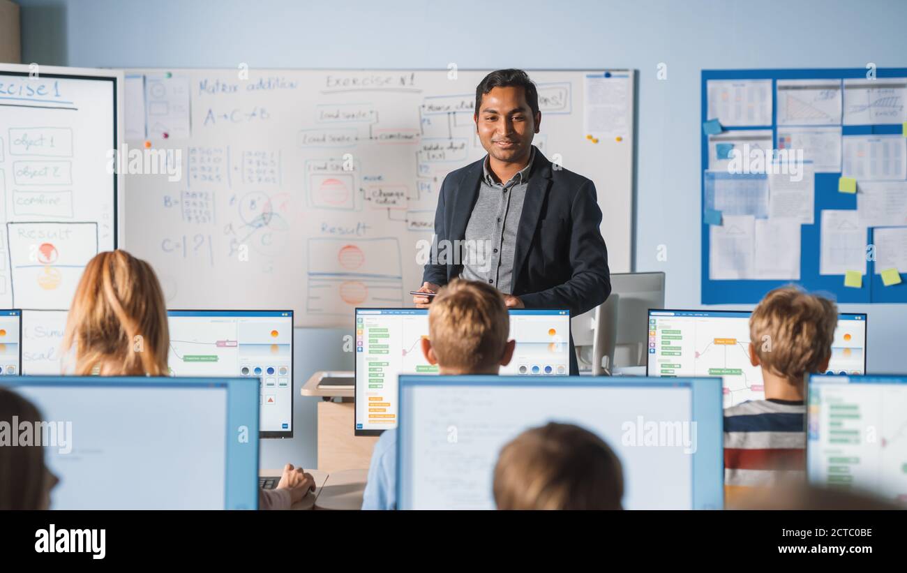 Elementary School Computer Science Class: Teacher Uses Digital Tablet ...