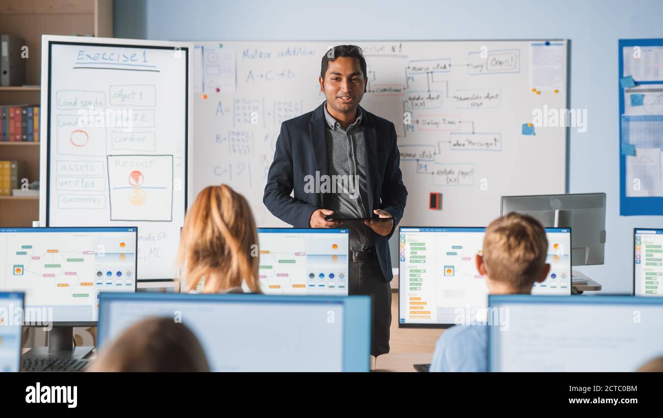 Elementary School Computer Science Class: Teacher Uses Digital Tablet ...