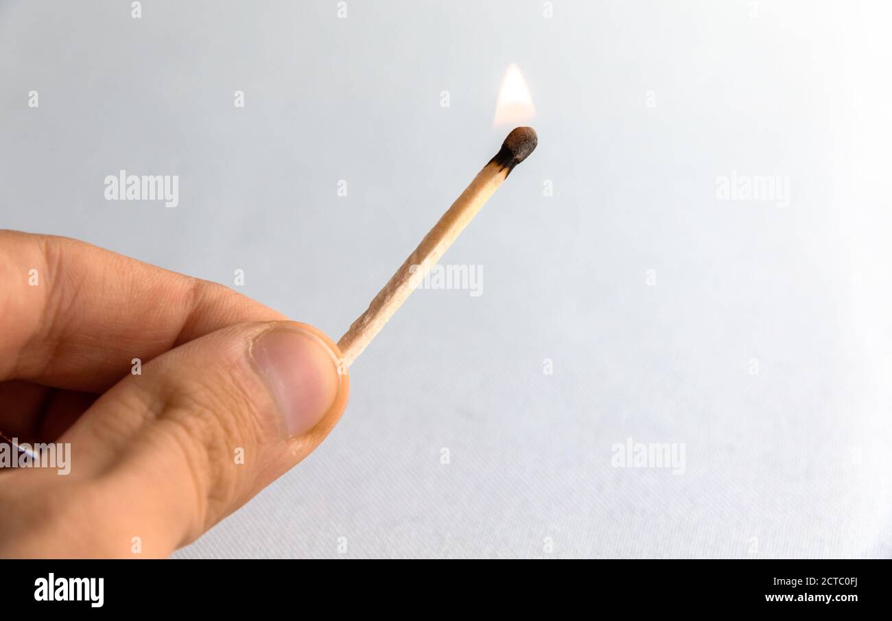 Match in hand isolated on white Stock Photo - Alamy