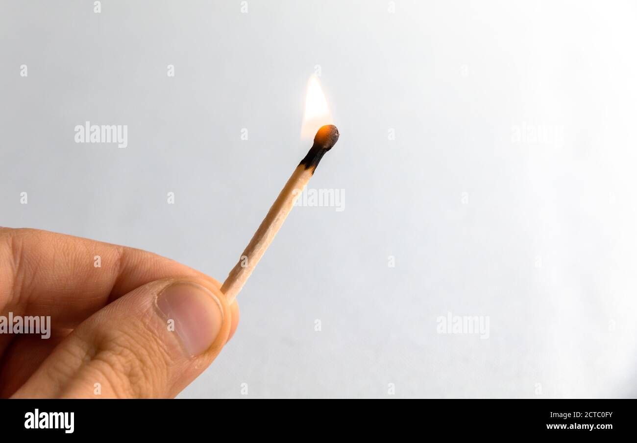 Match in hand isolated on white Stock Photo - Alamy