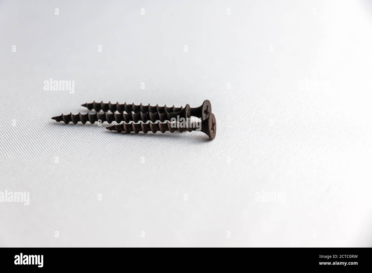 Close-up hand holds a self-tapping screw and a screwdriver Stock Photo ...