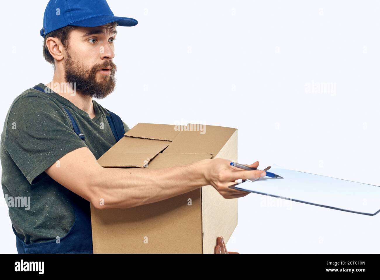 Working male courier with box in hand documents delivery service light ...