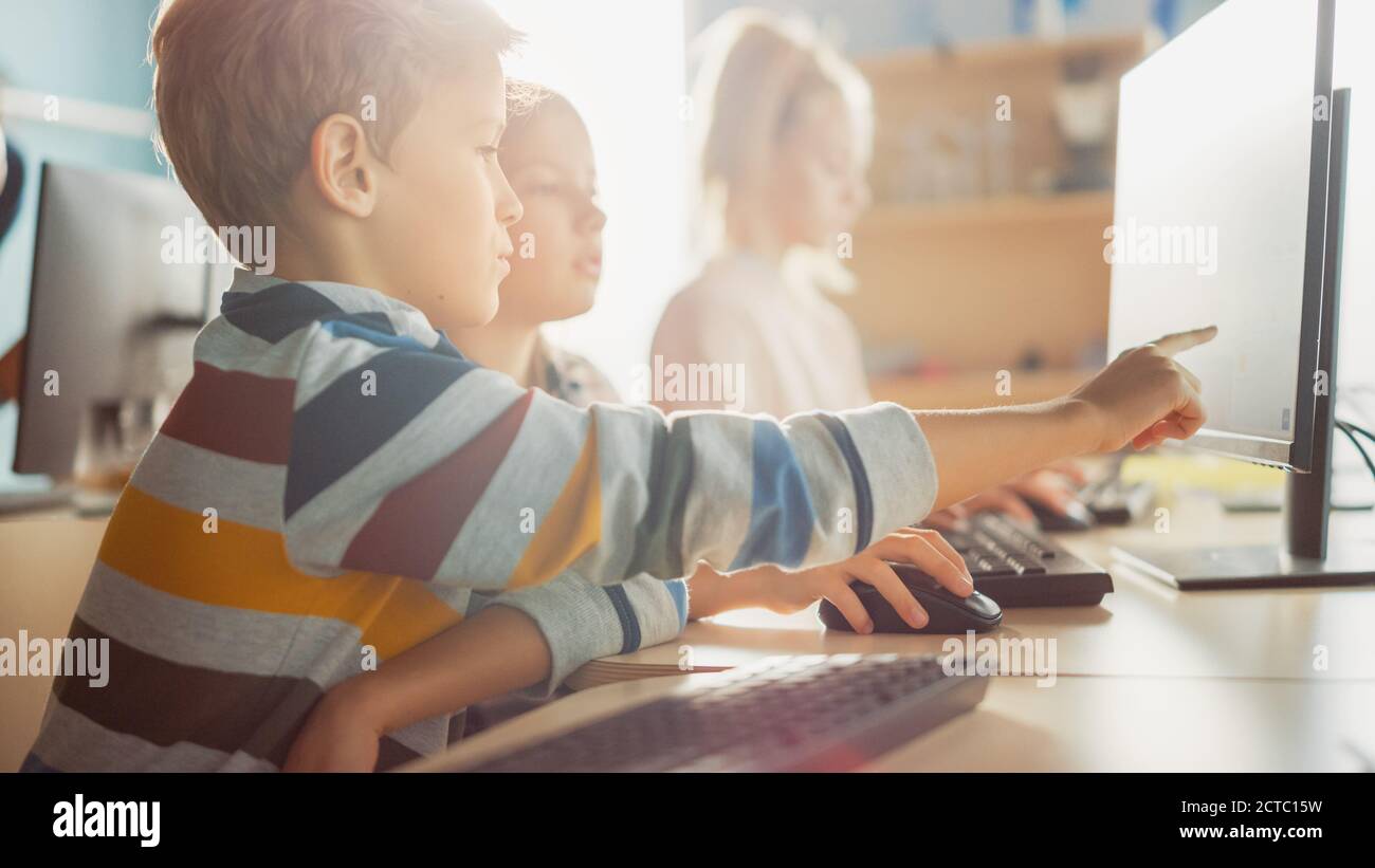 Elementary School Computer Science Classroom: Portrait of Smart Girl ...