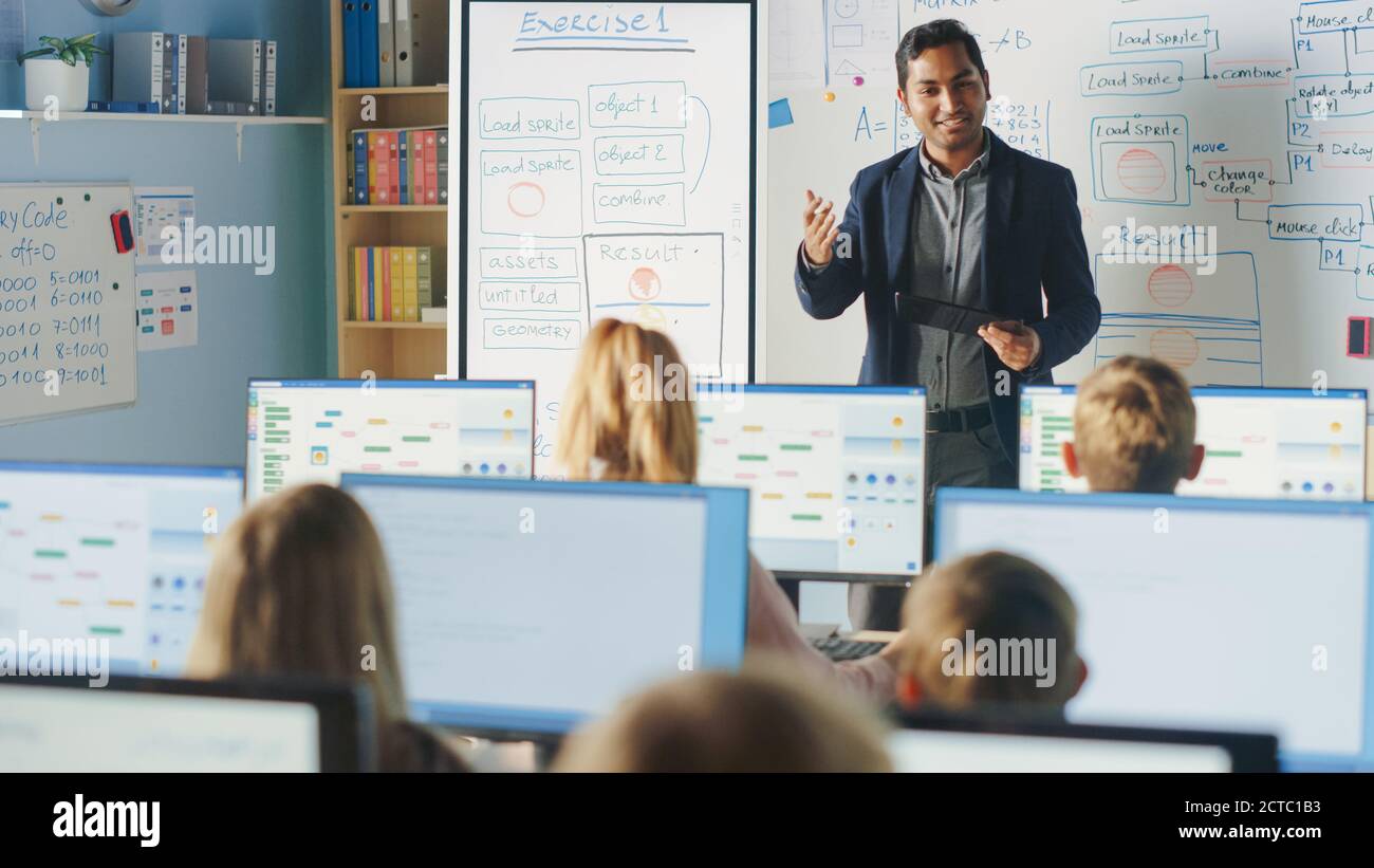 Elementary School Computer Science Class: Teacher Uses Digital Tablet ...
