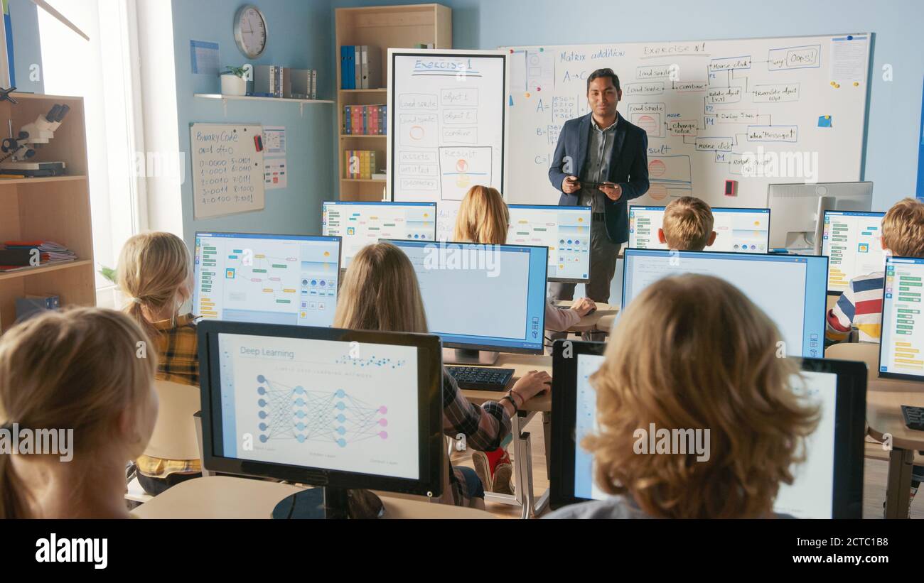 Elementary School Computer Science Class: Teacher Uses Digital Tablet ...