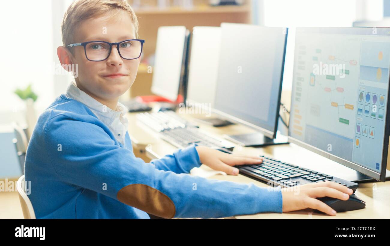 Elementary School Computer Science Classroom: Cute Little Boy wearing ...