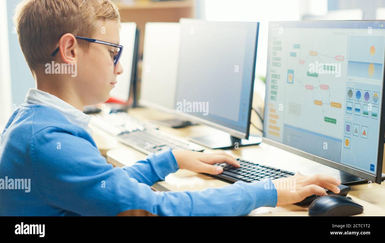 Elementary School Computer Science Classroom: Cute Little Boy wearing ...