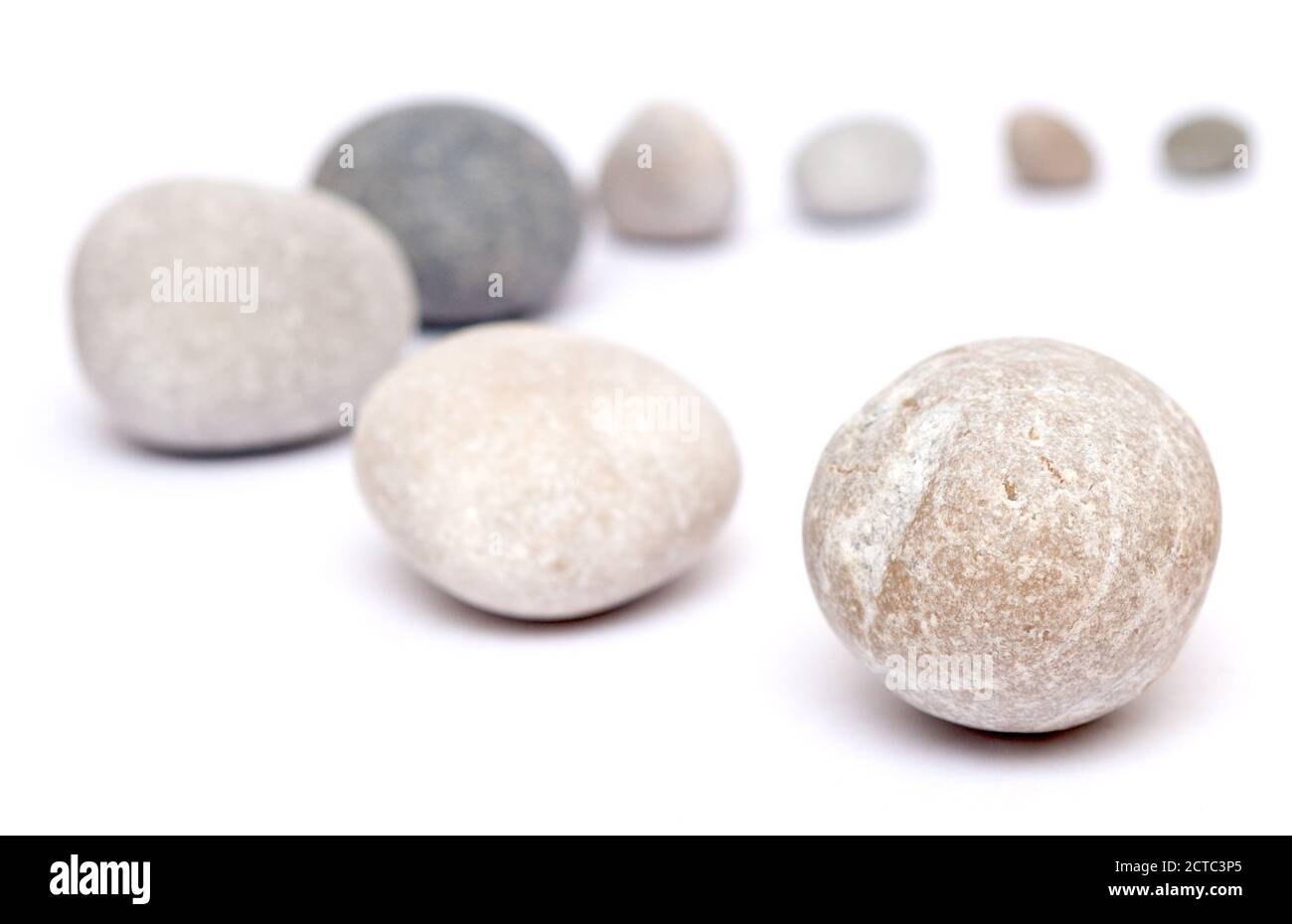 Stones on white background Stock Photo - Alamy