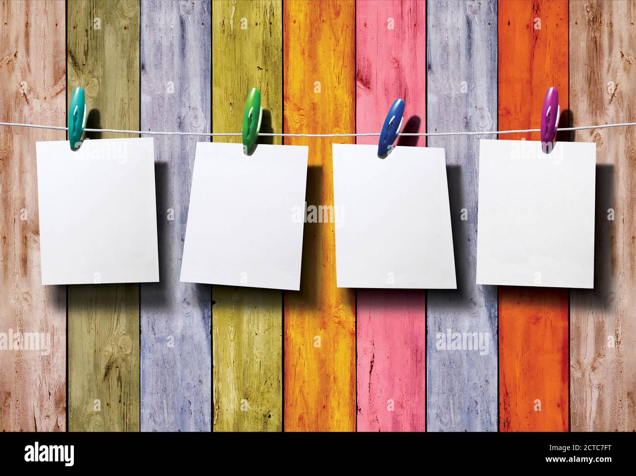 Clothespin hanging with photo papers on colourful wooden fence Stock ...