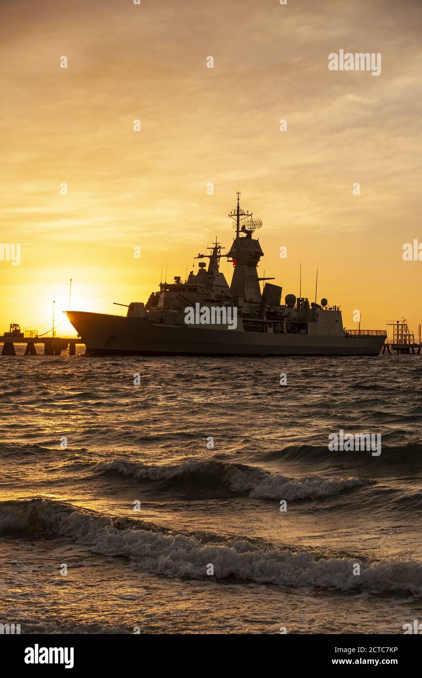 A portrait view of a Royal Australian Navy frigate at dawn Stock Photo ...