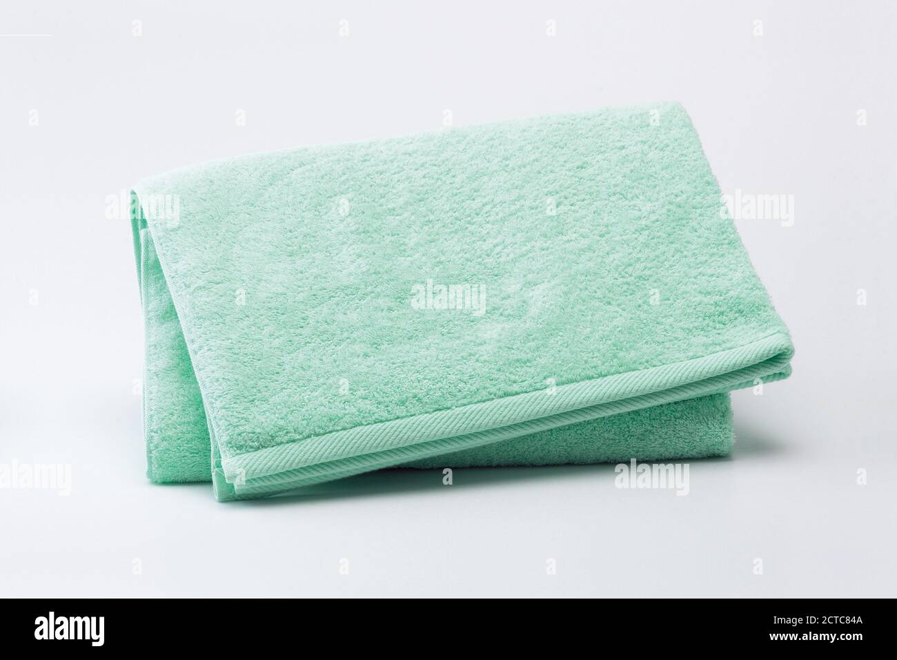 Soft bath towel on white background Stock Photo - Alamy