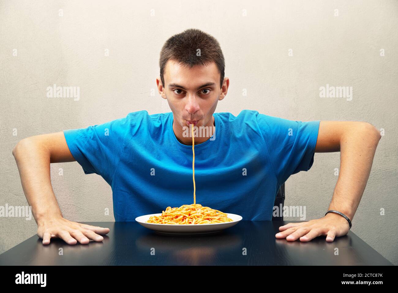 Greedy man eating hi-res stock photography and images - Alamy