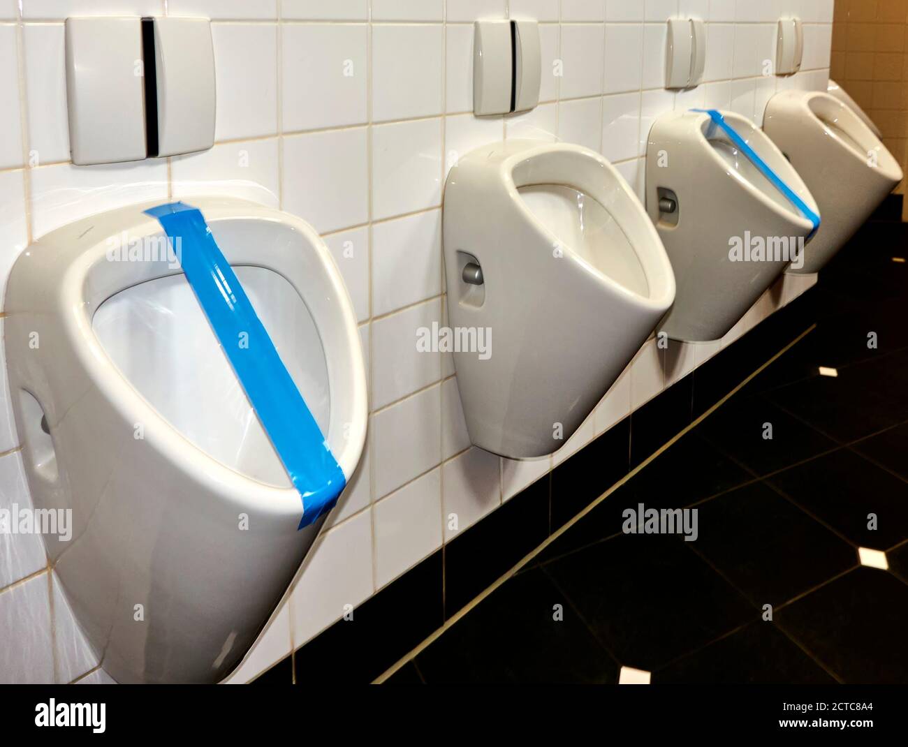 Urinals in a mens toilet, with pee basins closed due to corona Stock ...