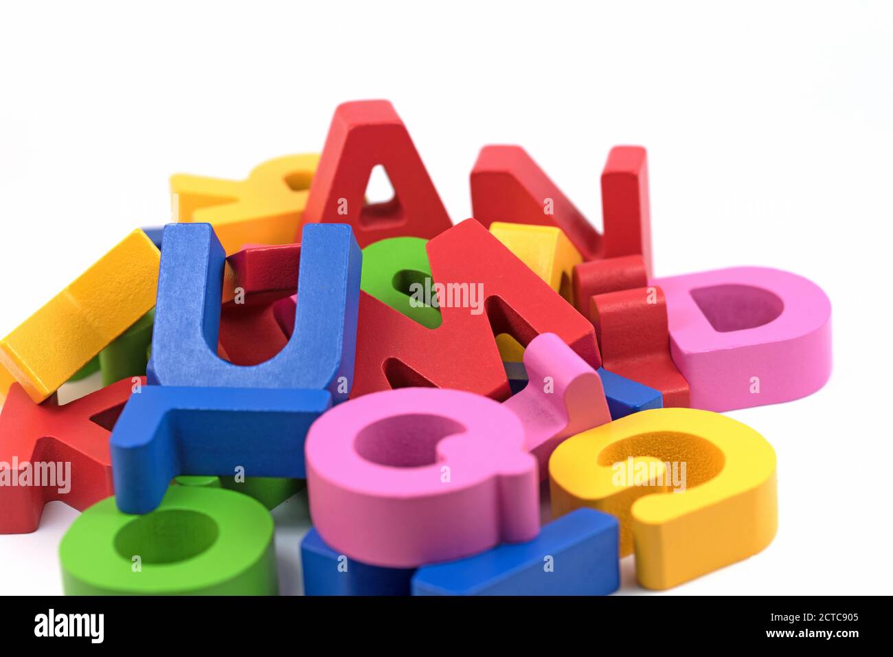 Colorful wooden letters against white background Stock Photo - Alamy